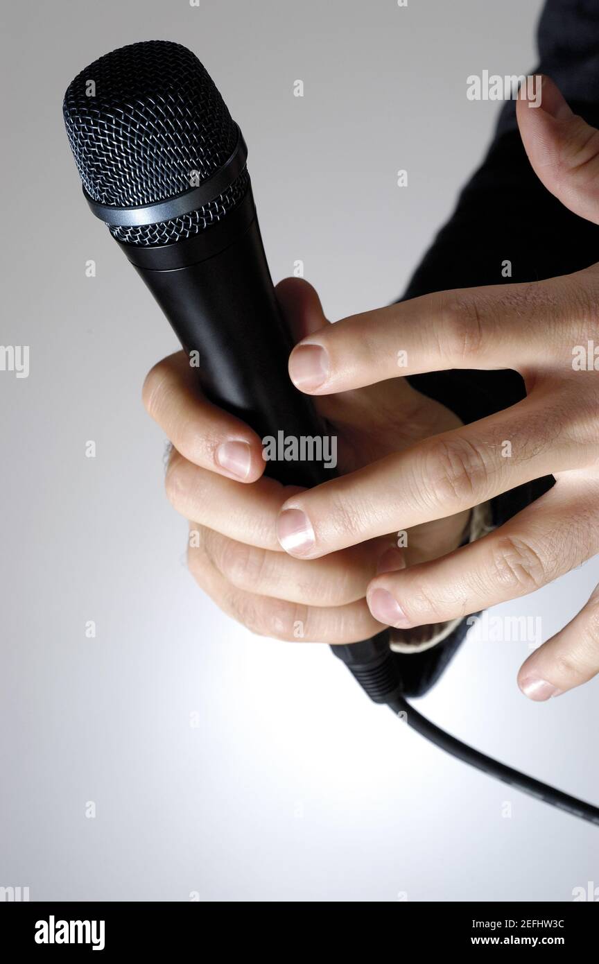 Hand Holding A Microphone High Resolution Stock Photography and Images ...
