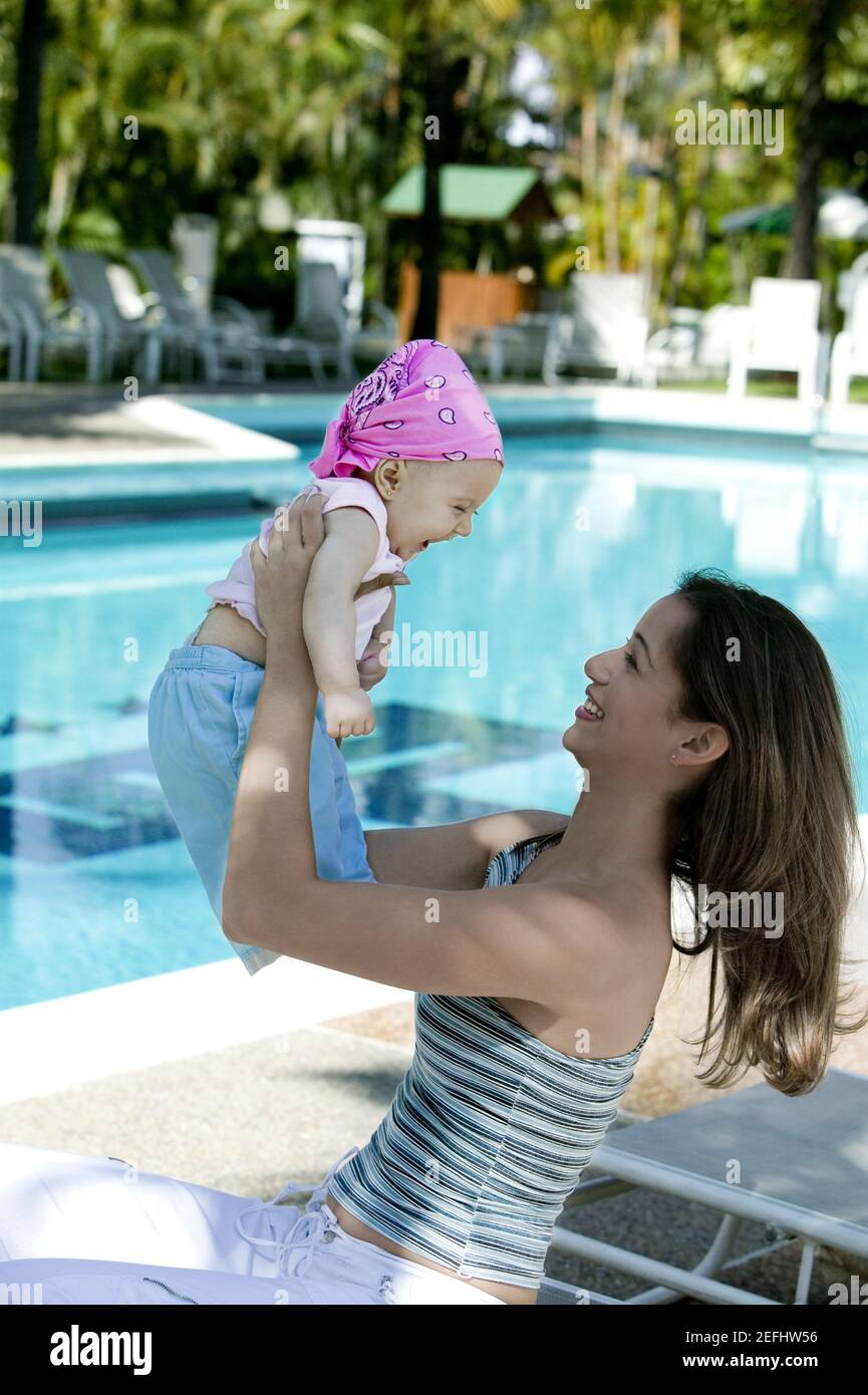 Child lifting other child up hi-res stock photography and images - Alamy