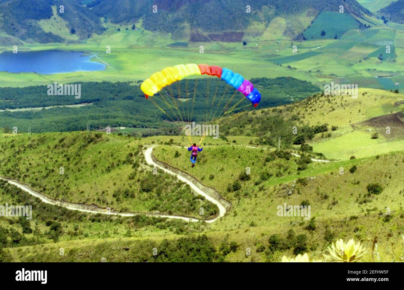 Aerial view of a person paragliding Stock Photo - Alamy