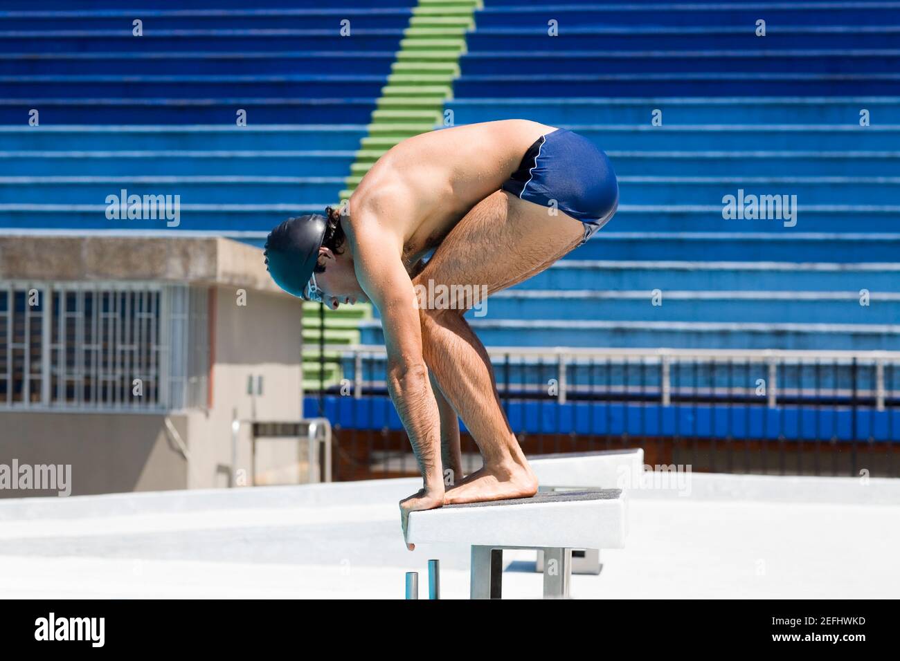 Side profile of a young man in diving position Stock Photo - Alamy
