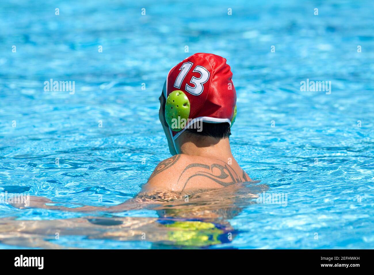 Side profile of a mid adult man swimming in a swimming pool Stock Photo ...