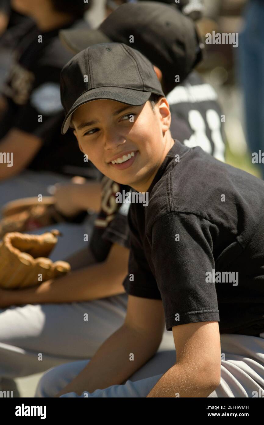 Side profile of a baseball player smiling Stock Photo - Alamy