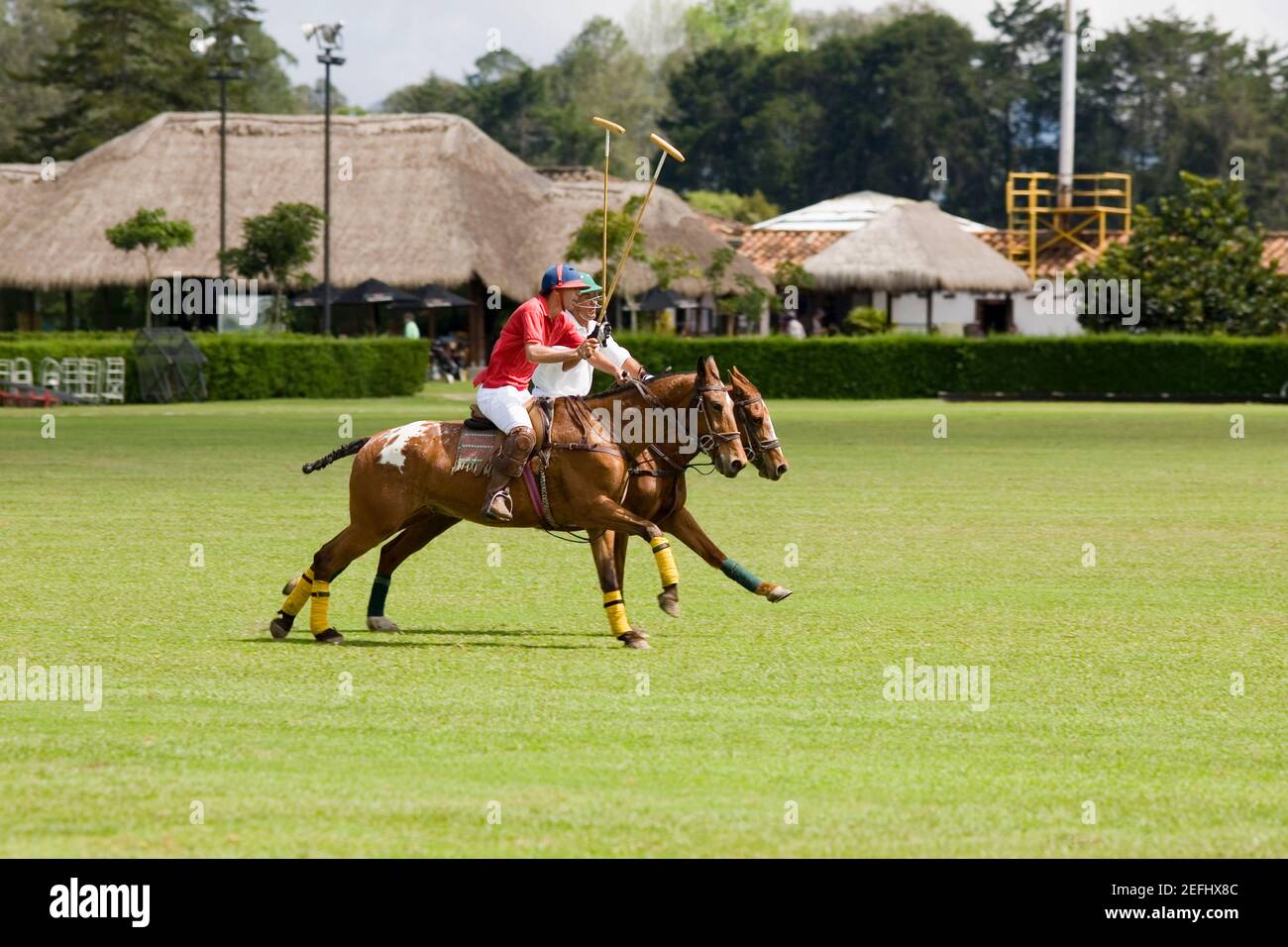 Polo players playing polo on horseback hi-res stock photography and ...