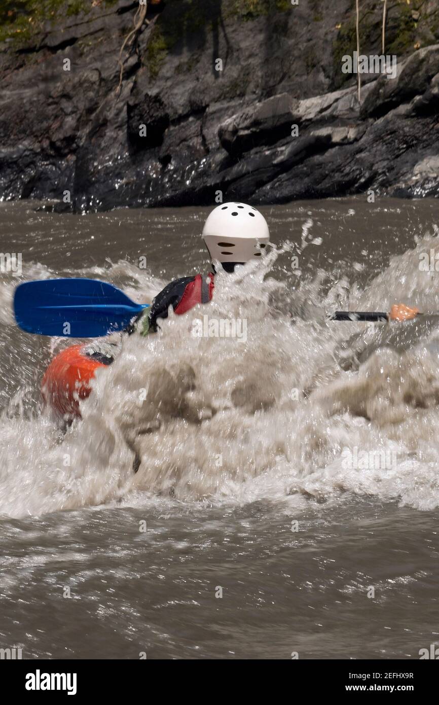 Rear view of a person kayaking in a river Stock Photo - Alamy