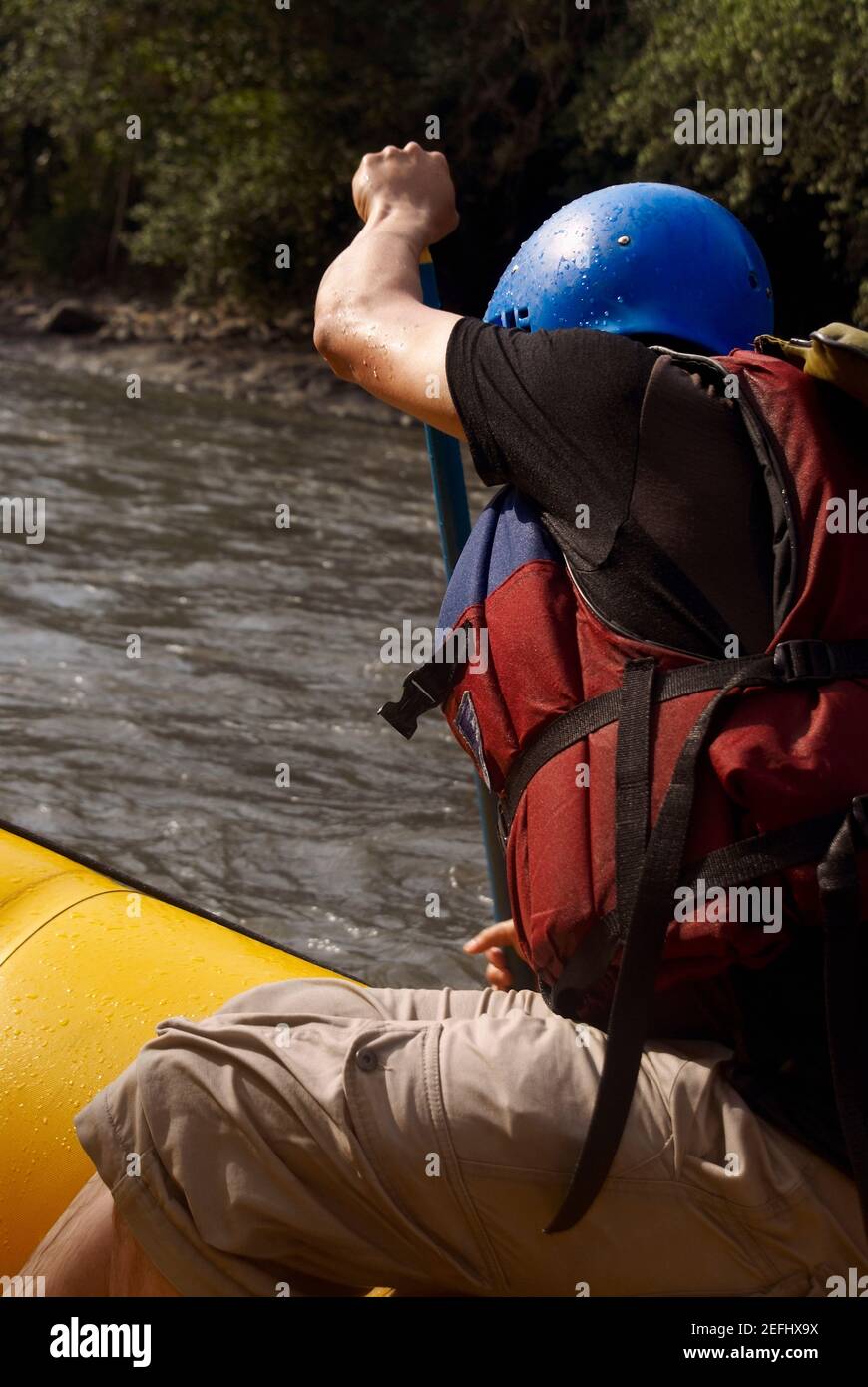 Side profile of a person rafting in a river Stock Photo - Alamy