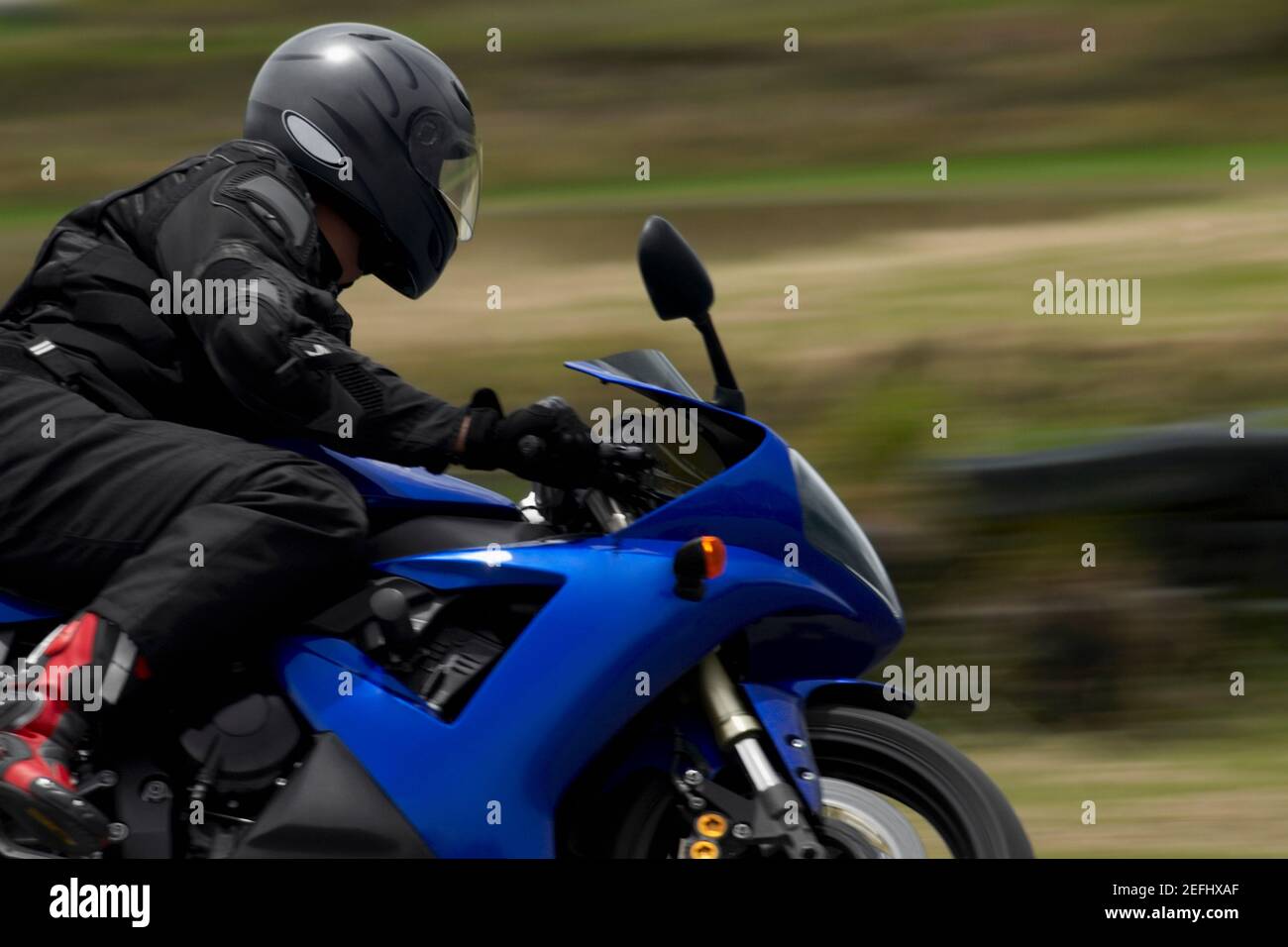 Side profile of a person riding a motorcycle Stock Photo - Alamy