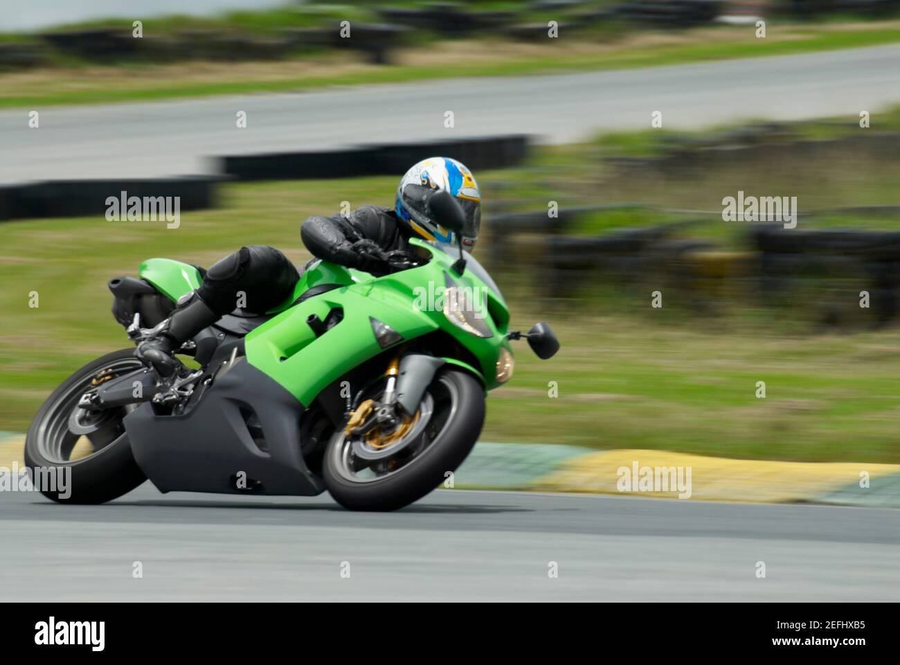 Person riding a motorcycle on a motor racing track Stock Photo - Alamy