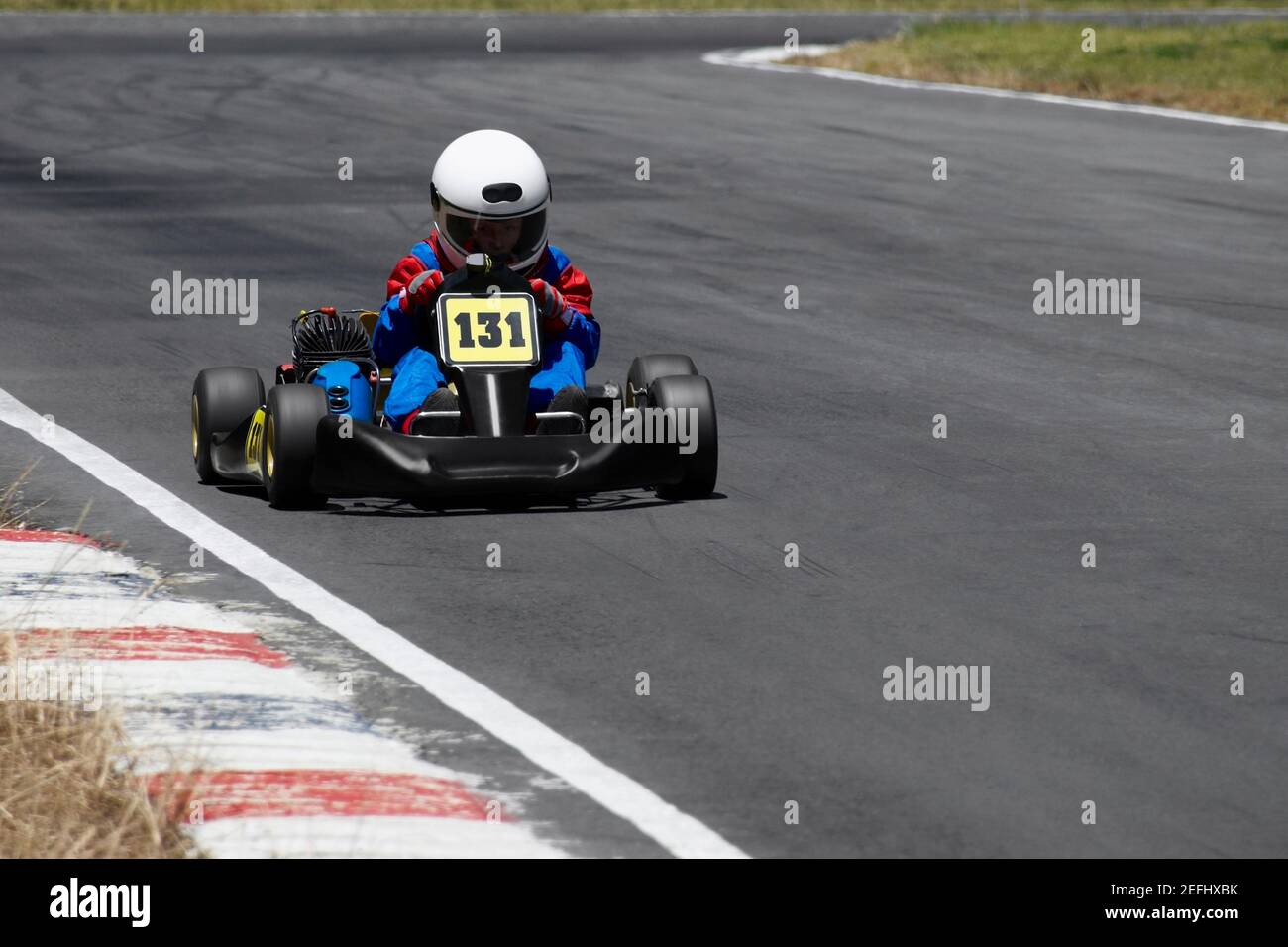 Person go-carting on a motor racing track Stock Photo - Alamy