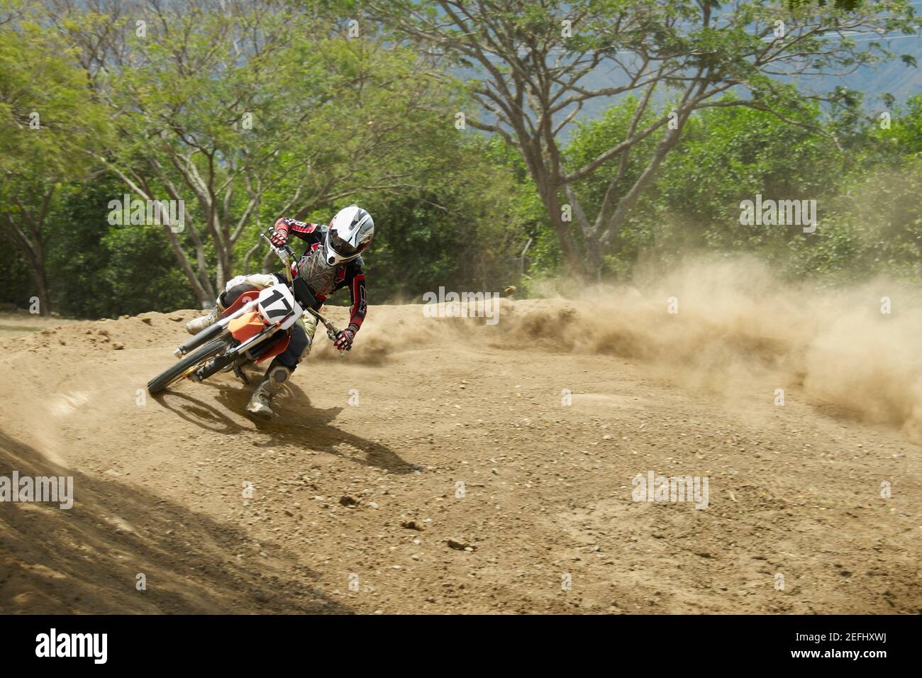 Motocross rider leaning into a turn Stock Photo - Alamy