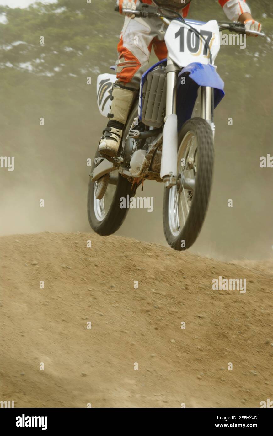 Motocross rider riding a motorcycle Stock Photo - Alamy