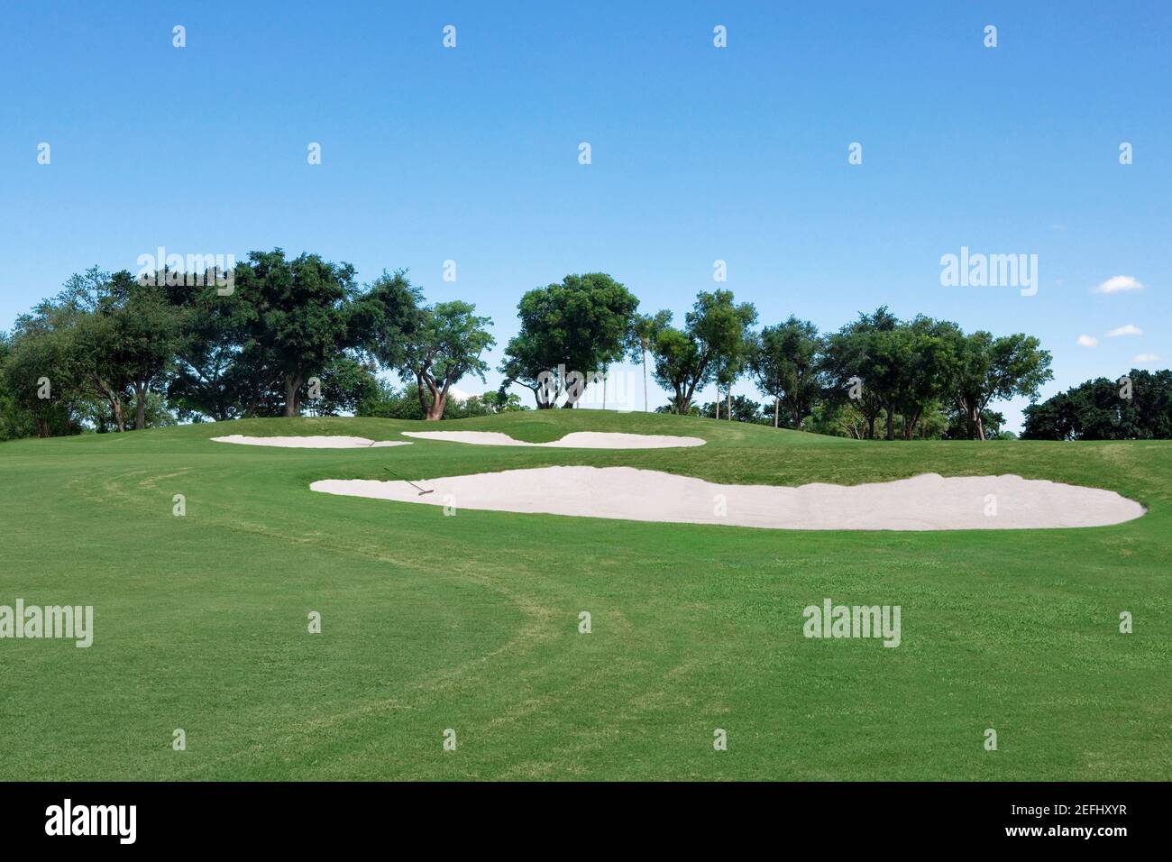 Sand trap in a golf course Stock Photo - Alamy