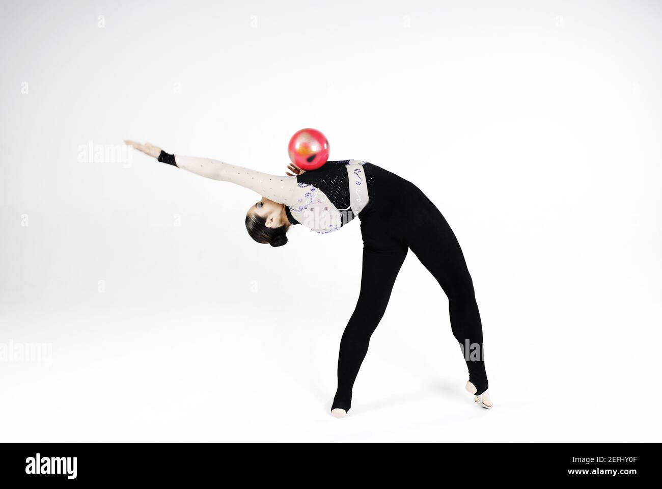 Female gymnast practicing with a ball Stock Photo - Alamy