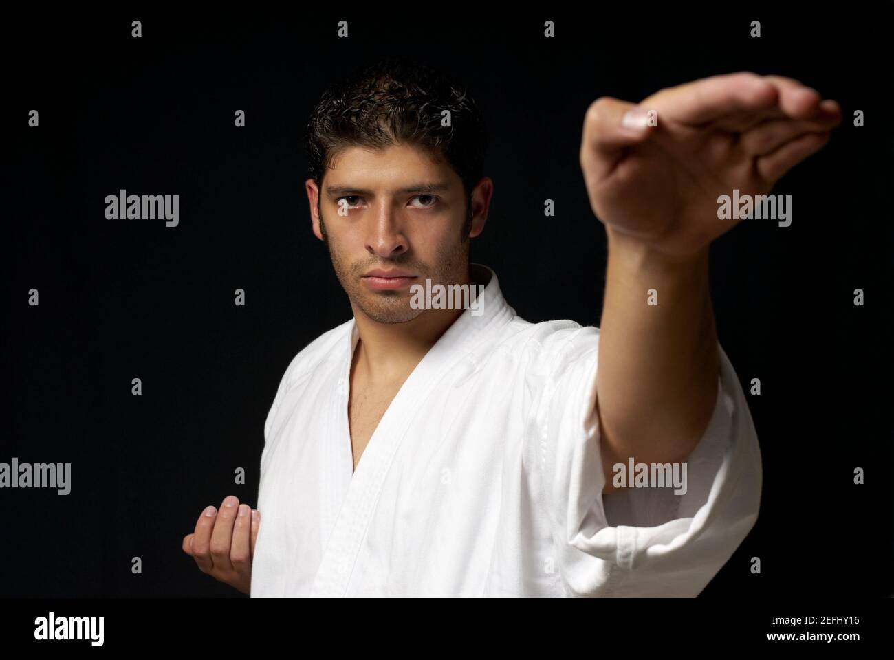 Portrait of a young man practicing karate Stock Photo - Alamy