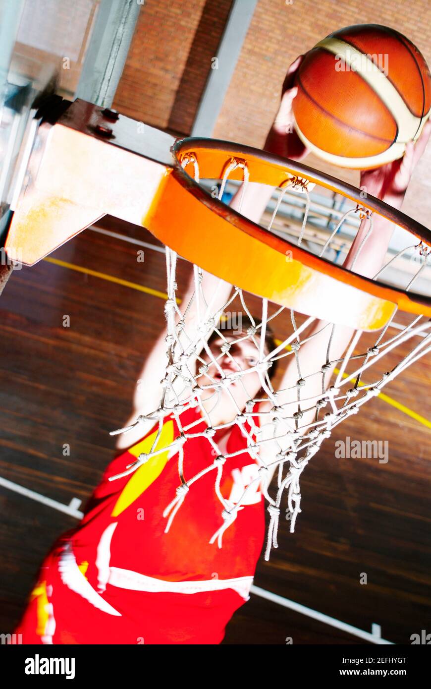 Basketball player shooting at goal Stock Photo - Alamy