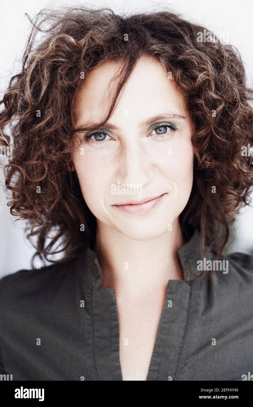 Beautiful woman smirking hi-res stock photography and images - Alamy