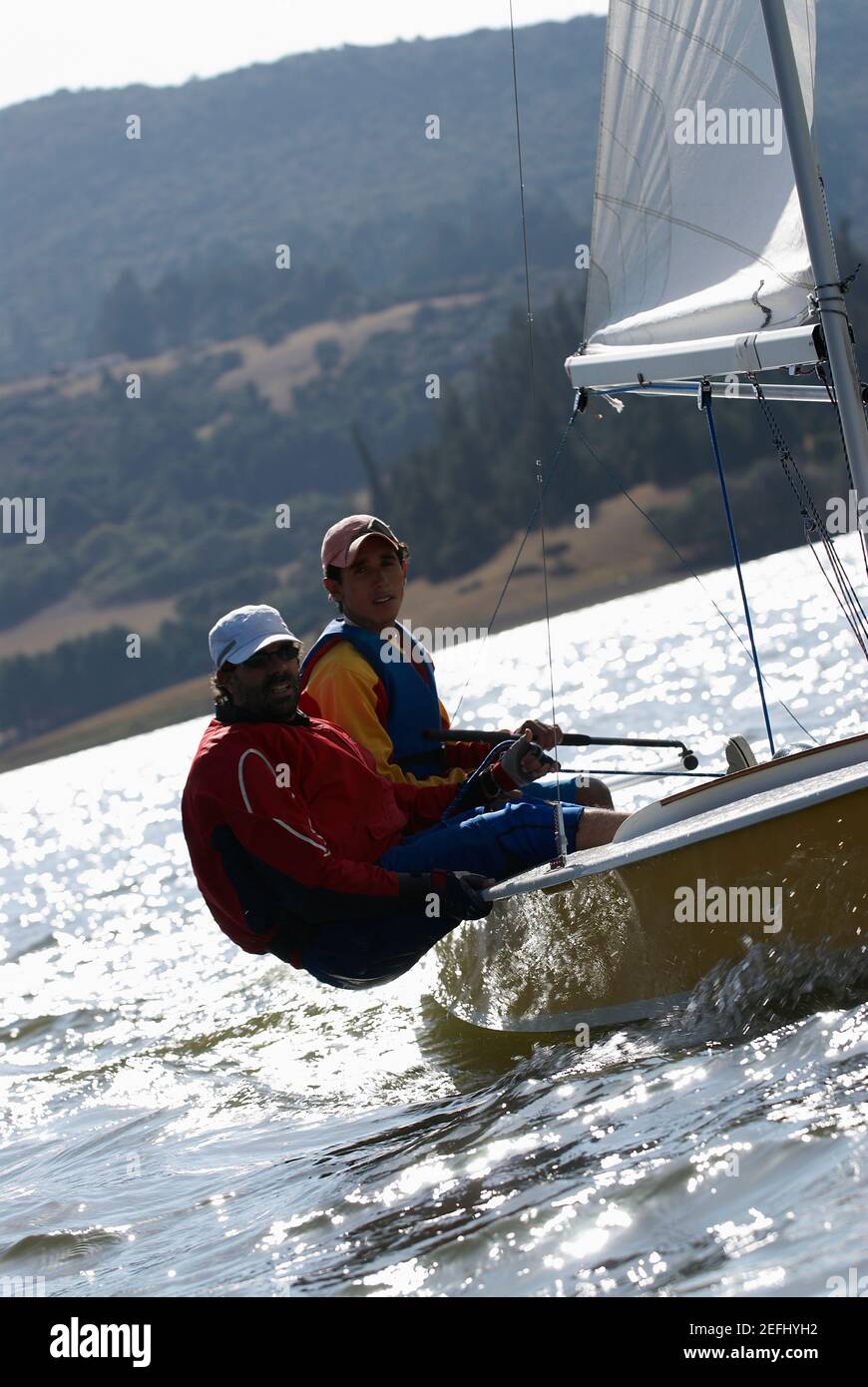 Three men sailing in a boat hi-res stock photography and images - Alamy