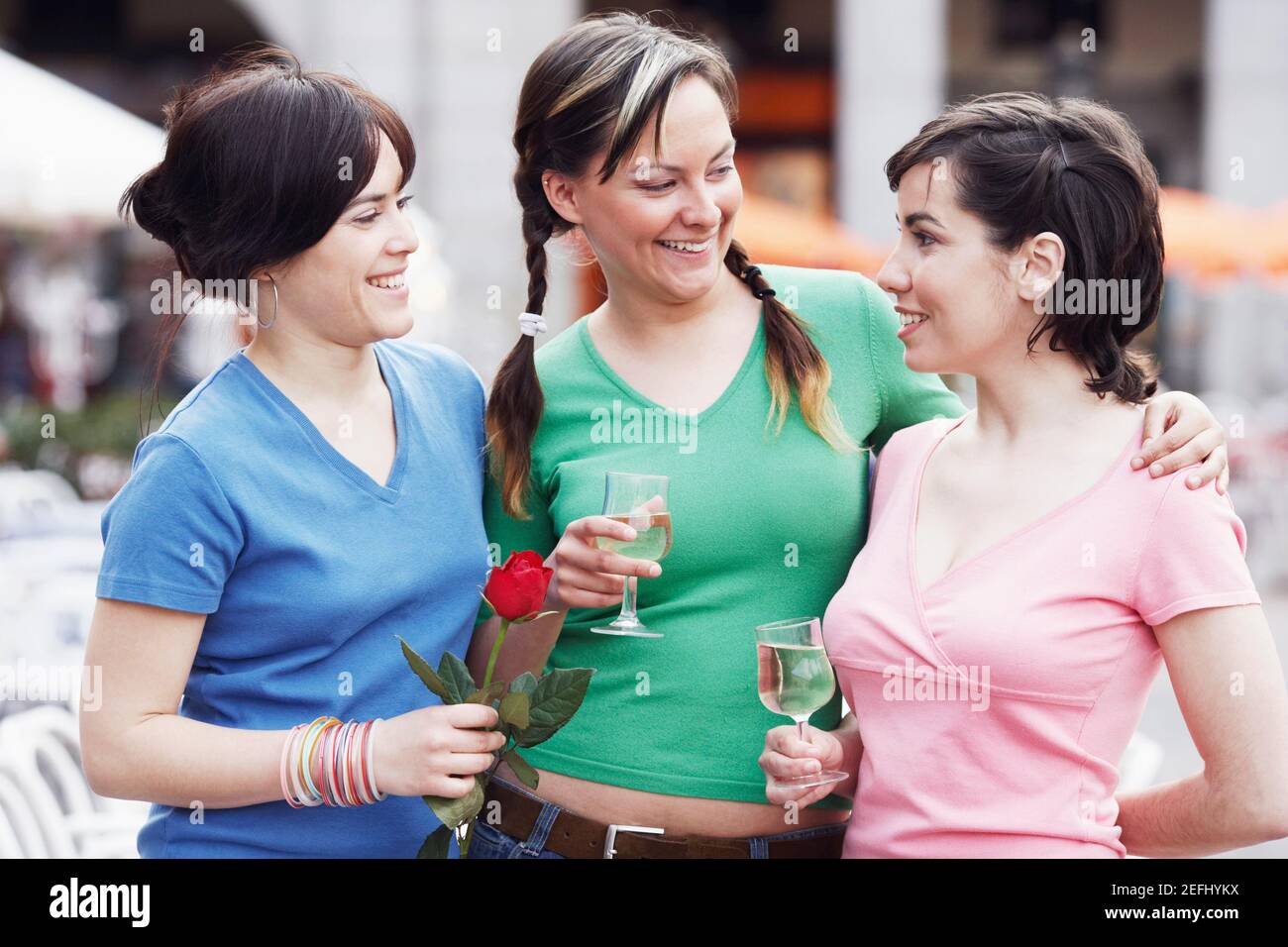 Close-up of three young women standing together Stock Photo - Alamy