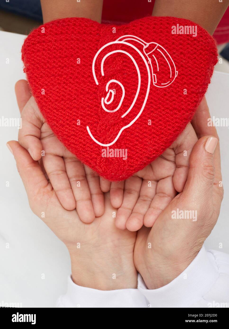 Audiologist holding hearing aid hi-res stock photography and images - Alamy