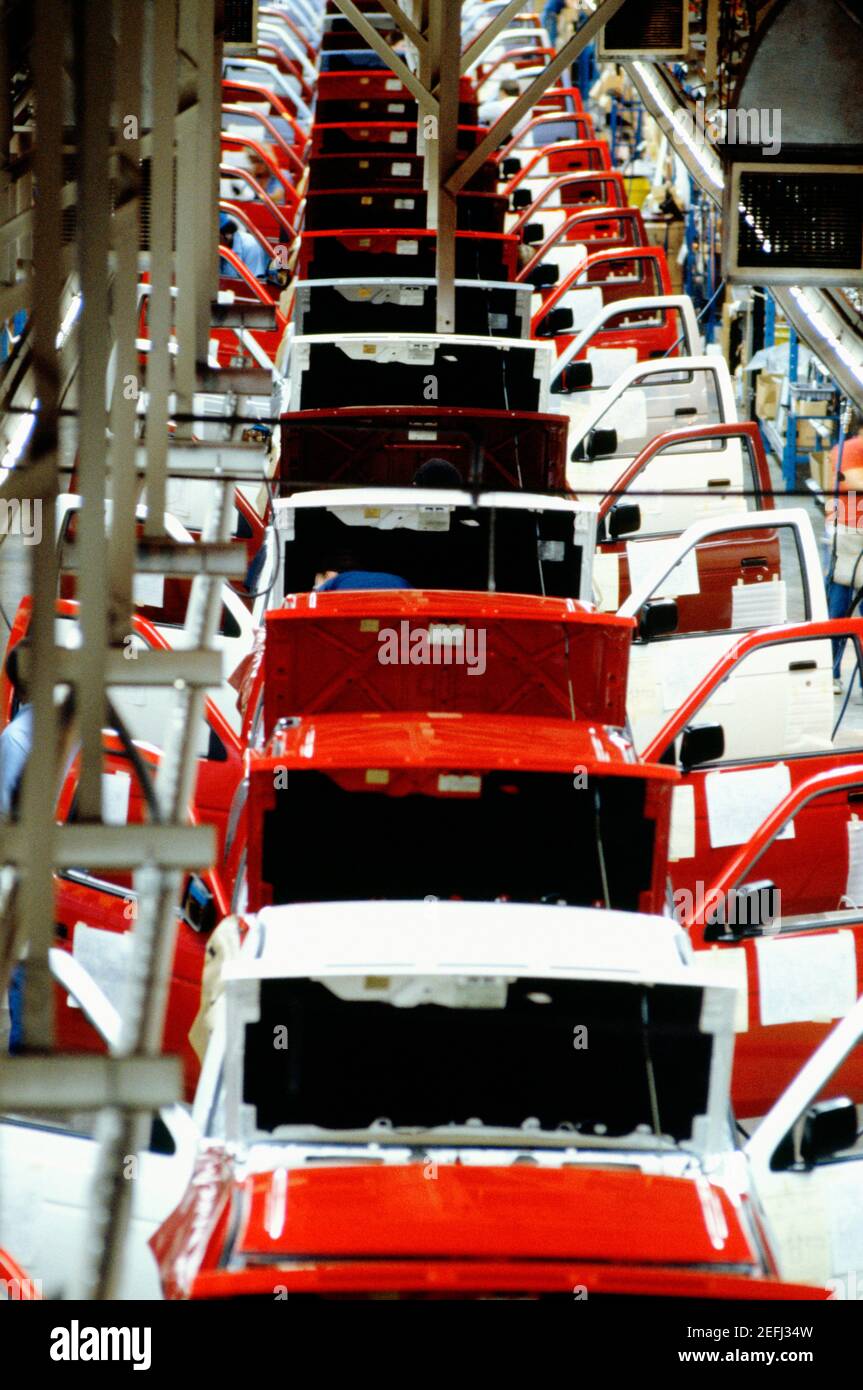 High angle view of manufactured cars on an assembly line in a factory ...