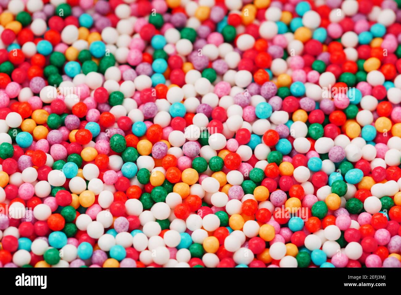 Colored balls texture as a background in full screen. Bright substrate ...