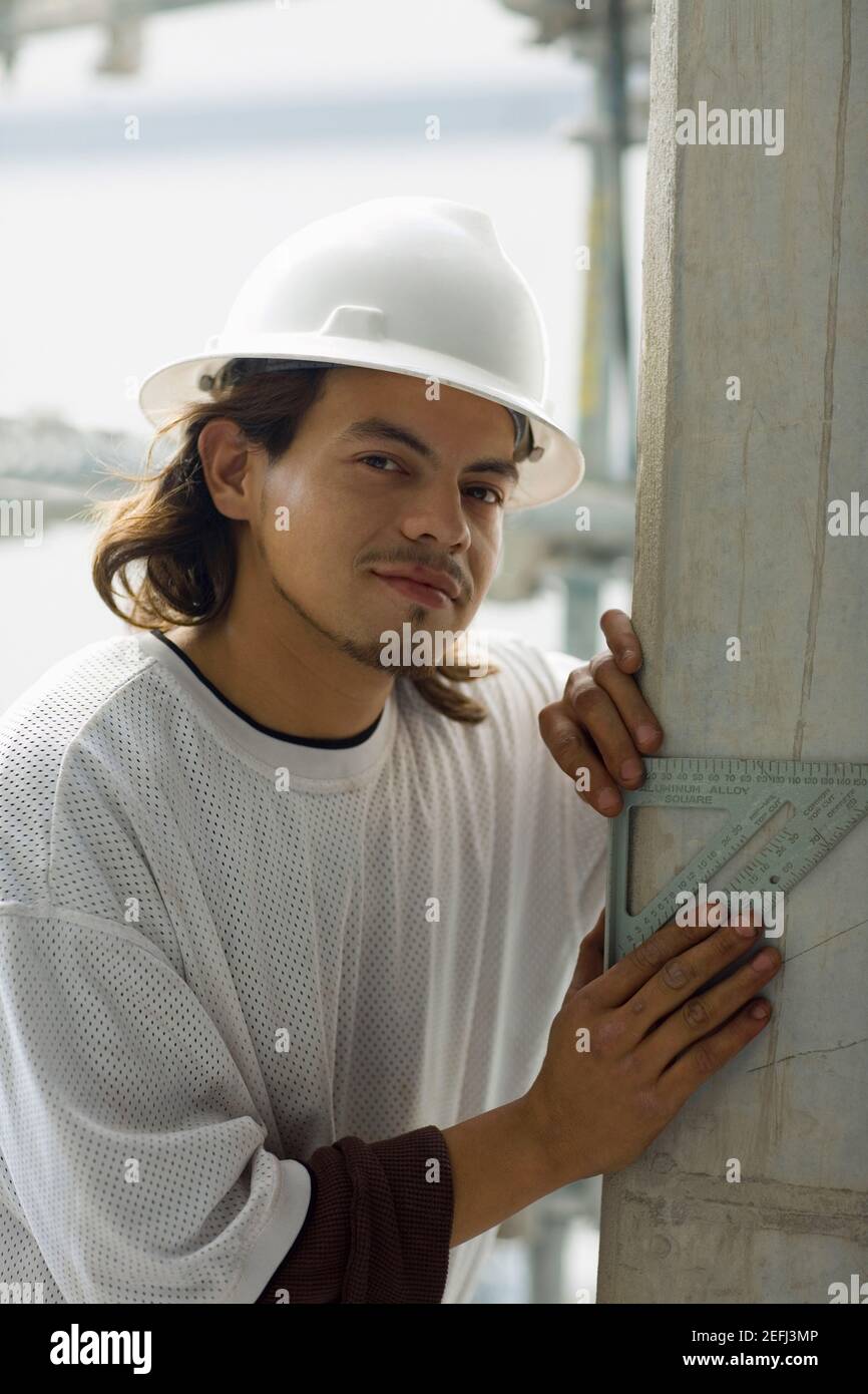 Portrait of a male construction worker using a set square Stock Photo ...