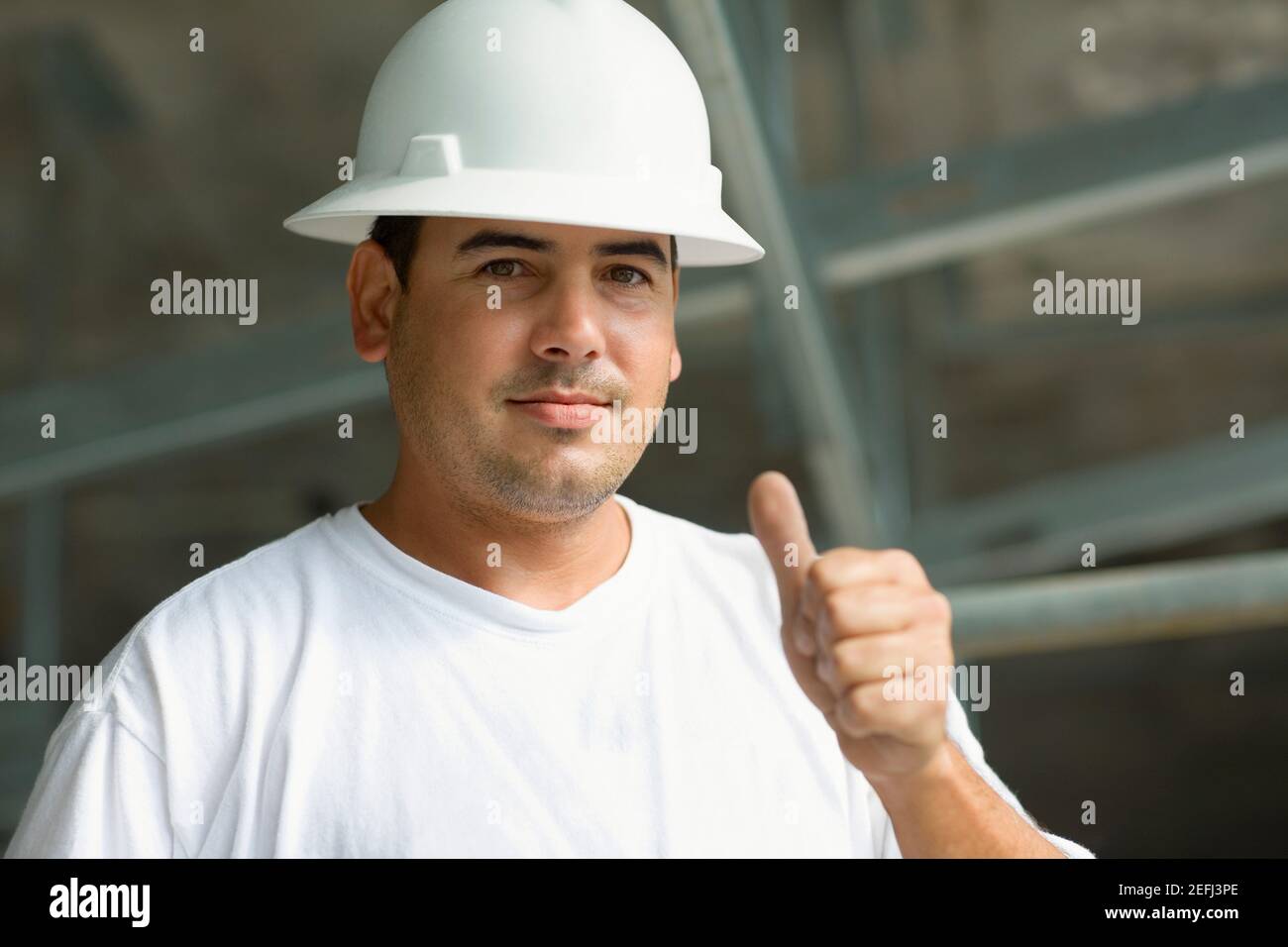 Portrait of a male construction worker showing a thumbs up sign Stock ...