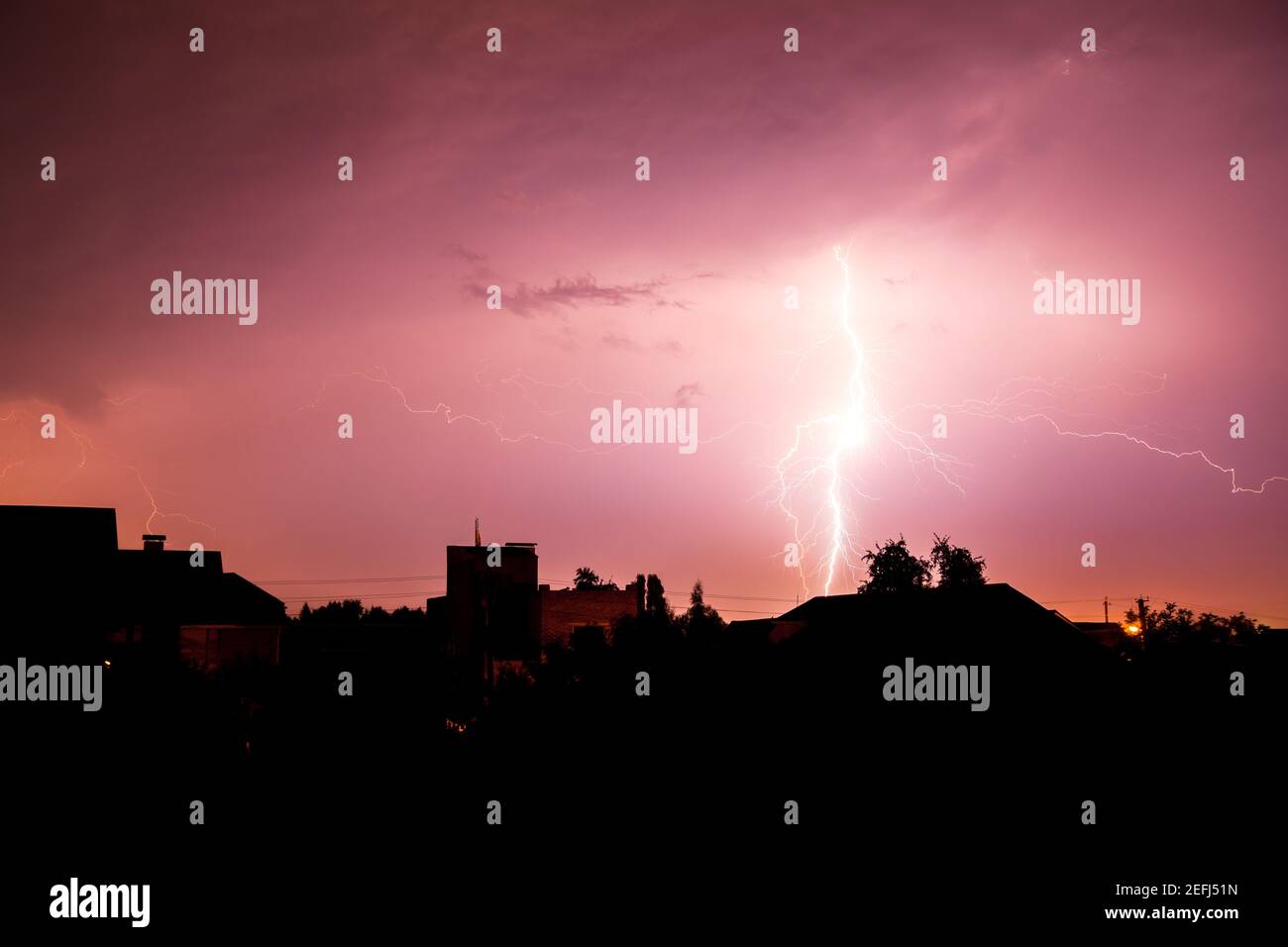Lightning over small town Stock Photo - Alamy