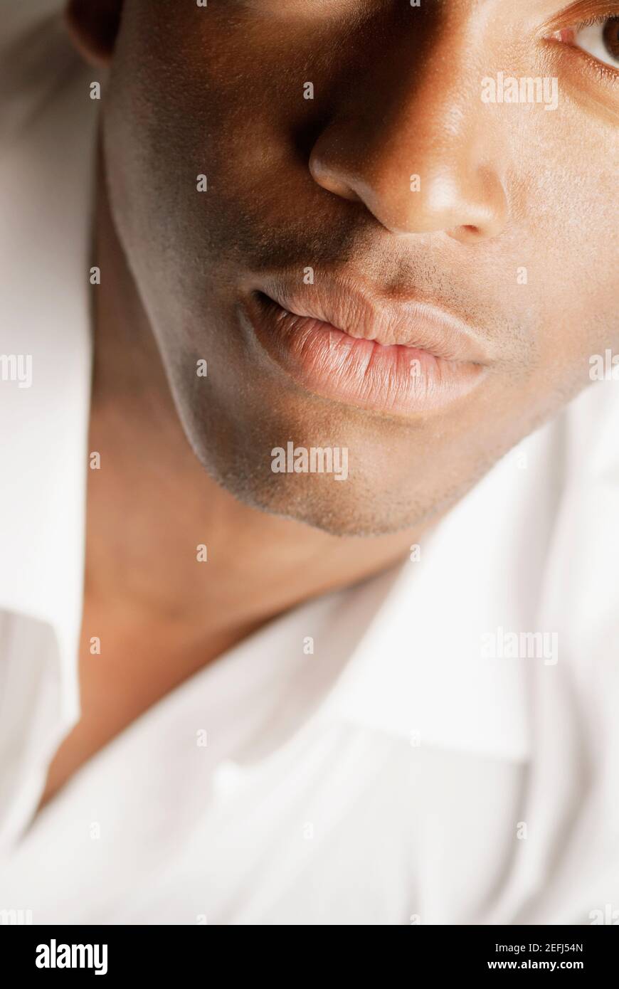 Young latin man staring camera hi-res stock photography and images - Alamy