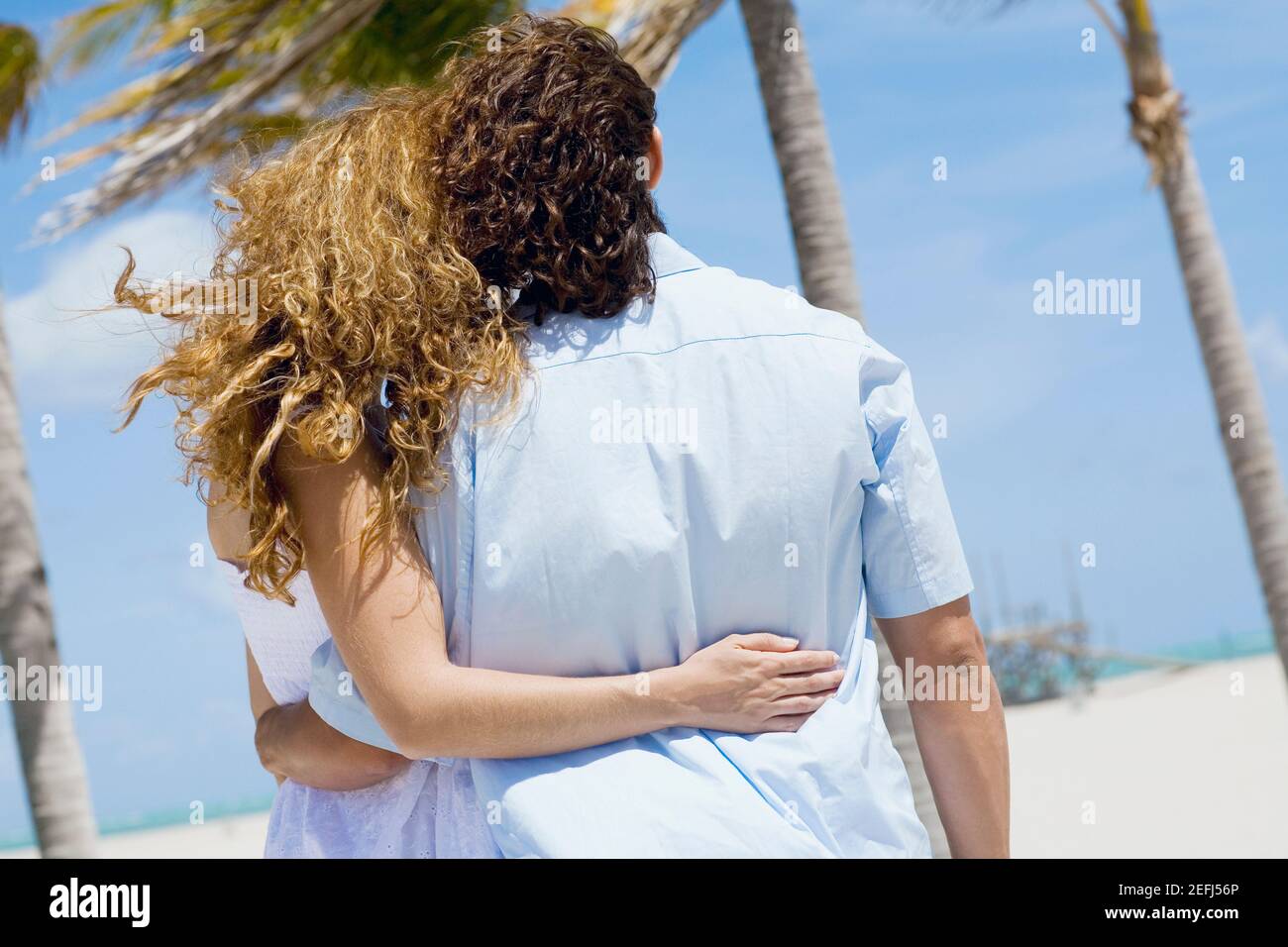 Couple arms around each other walking hi-res stock photography and ...