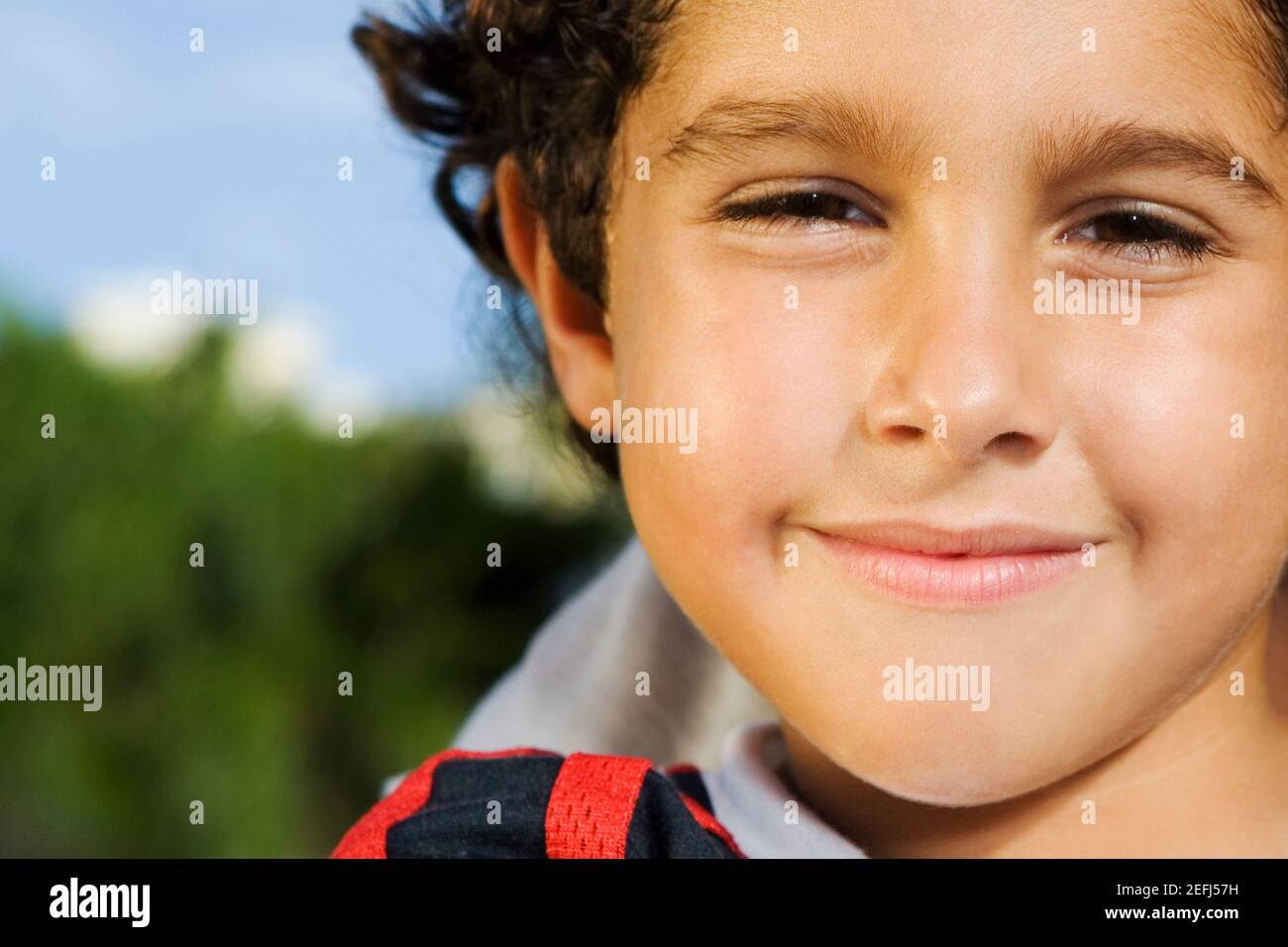 Portrait of a boy smirking Stock Photo - Alamy