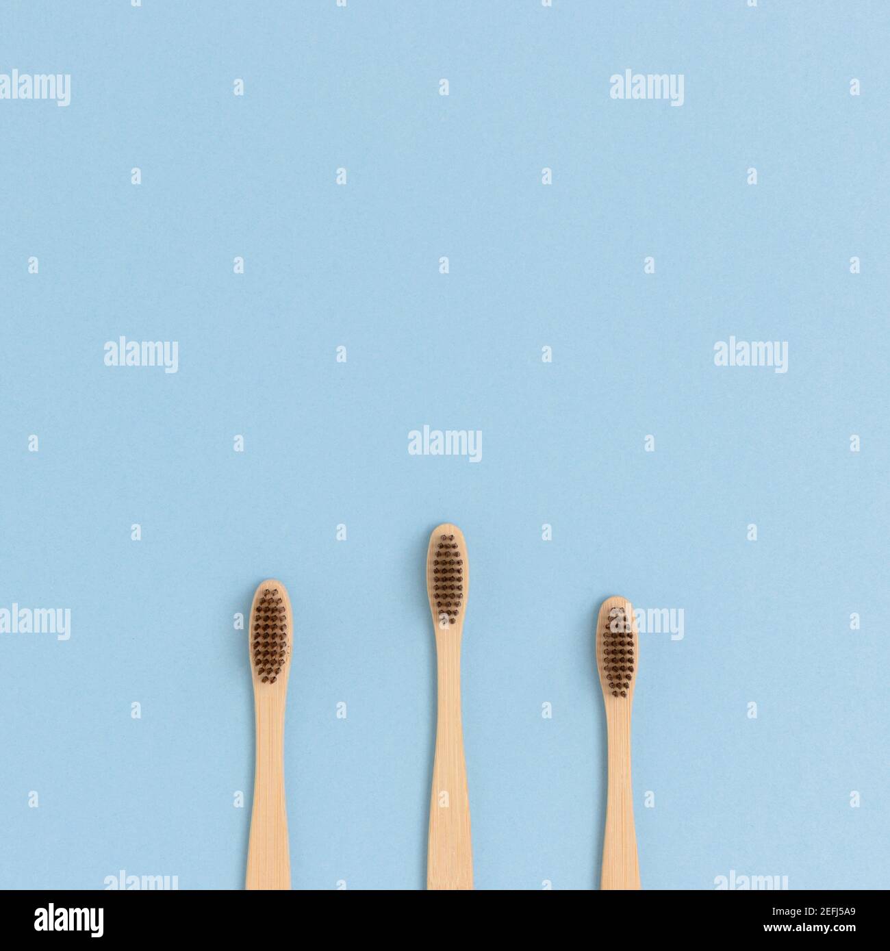 Frame made of toothbrushes on a blue background. Plastic free concept ...