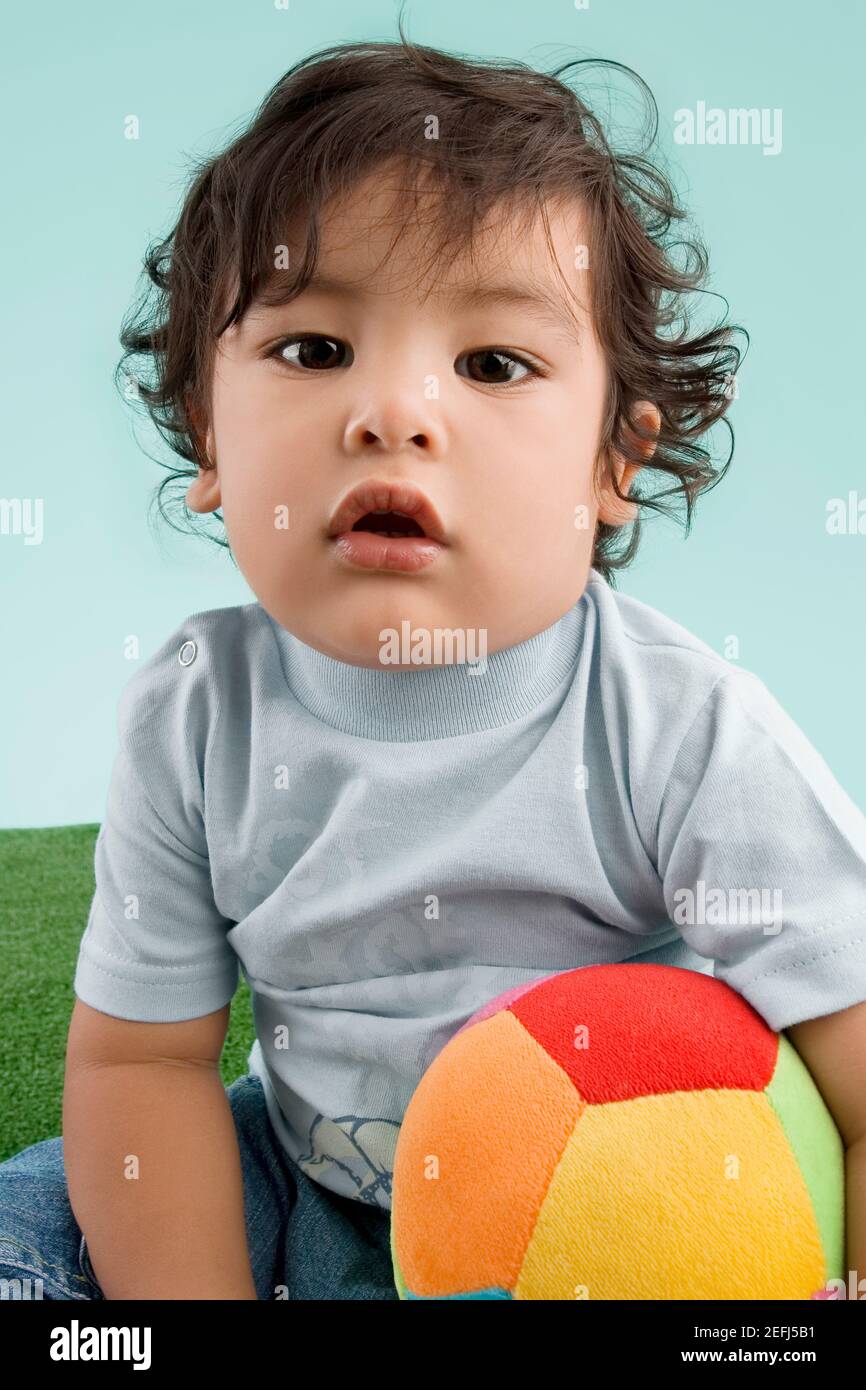 Black kid playing ball hi-res stock photography and images - Alamy