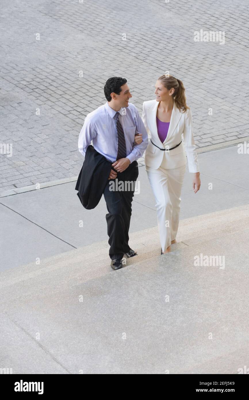 Walking arm in arm business hi-res stock photography and images - Alamy