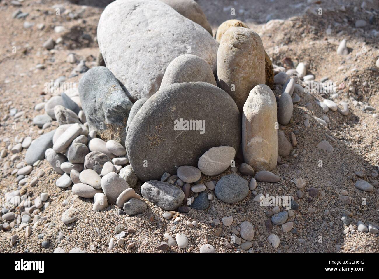 Rocks on the sand beach. Closeup of sand and rocks at a beach Stock ...