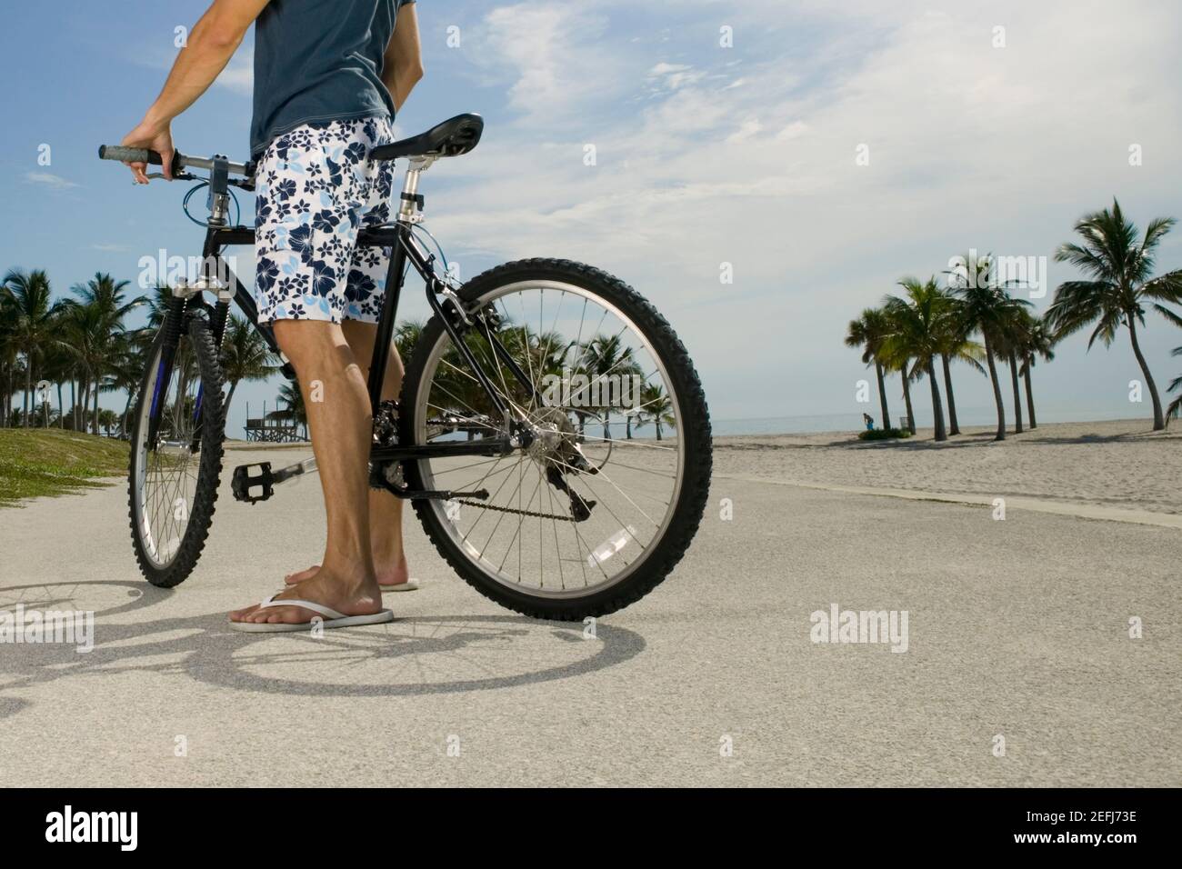 Standing by his bicycle hi-res stock photography and images - Alamy