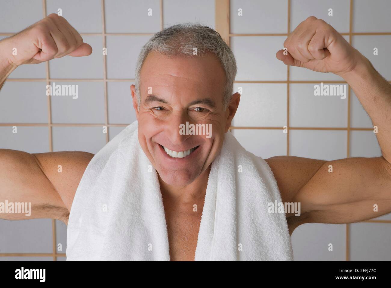 Old man flexing muscles hi-res stock photography and images - Alamy