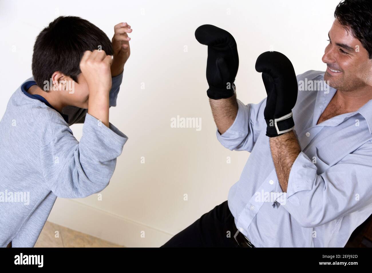 Close-up of a father and his son boxing Stock Photo - Alamy