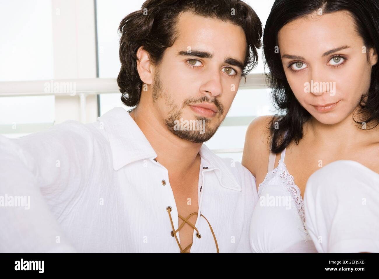 Couple sitting side by side hi-res stock photography and images - Alamy