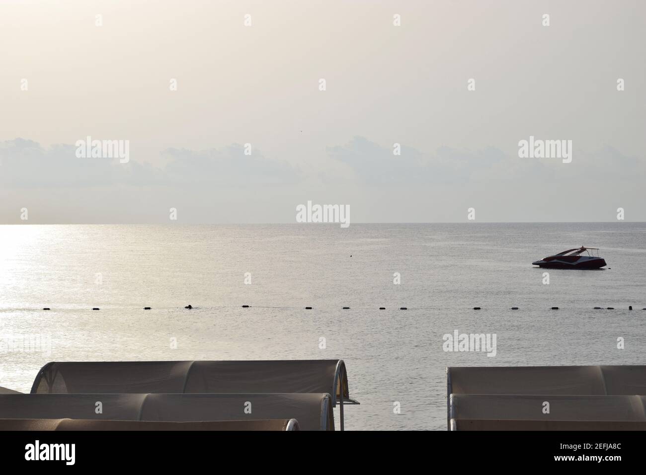 Early morning on a sandy beach without people. Beautiful sunny sunrise ...