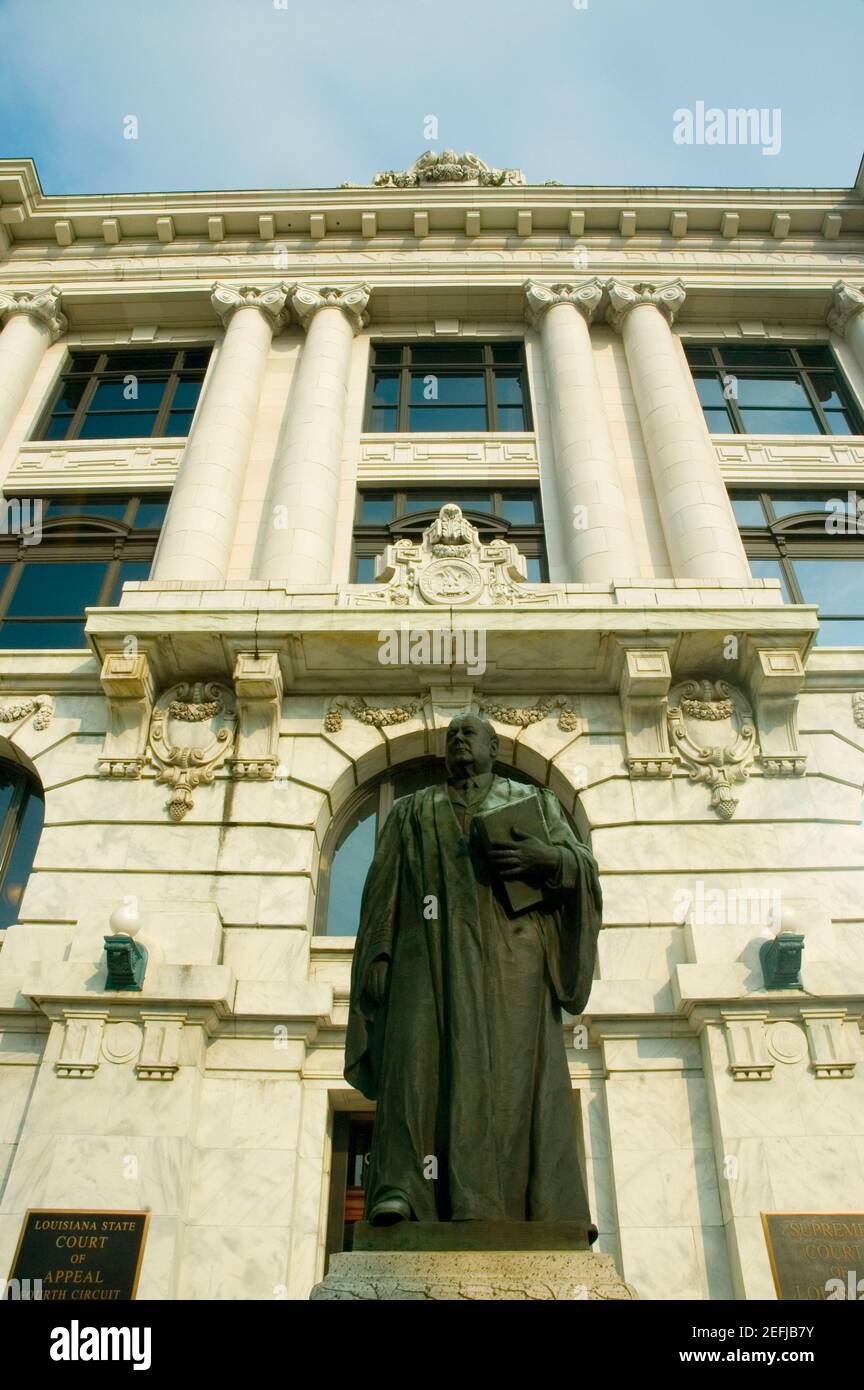 Low angle view of the statue of a judge in front of a courthouse, New ...