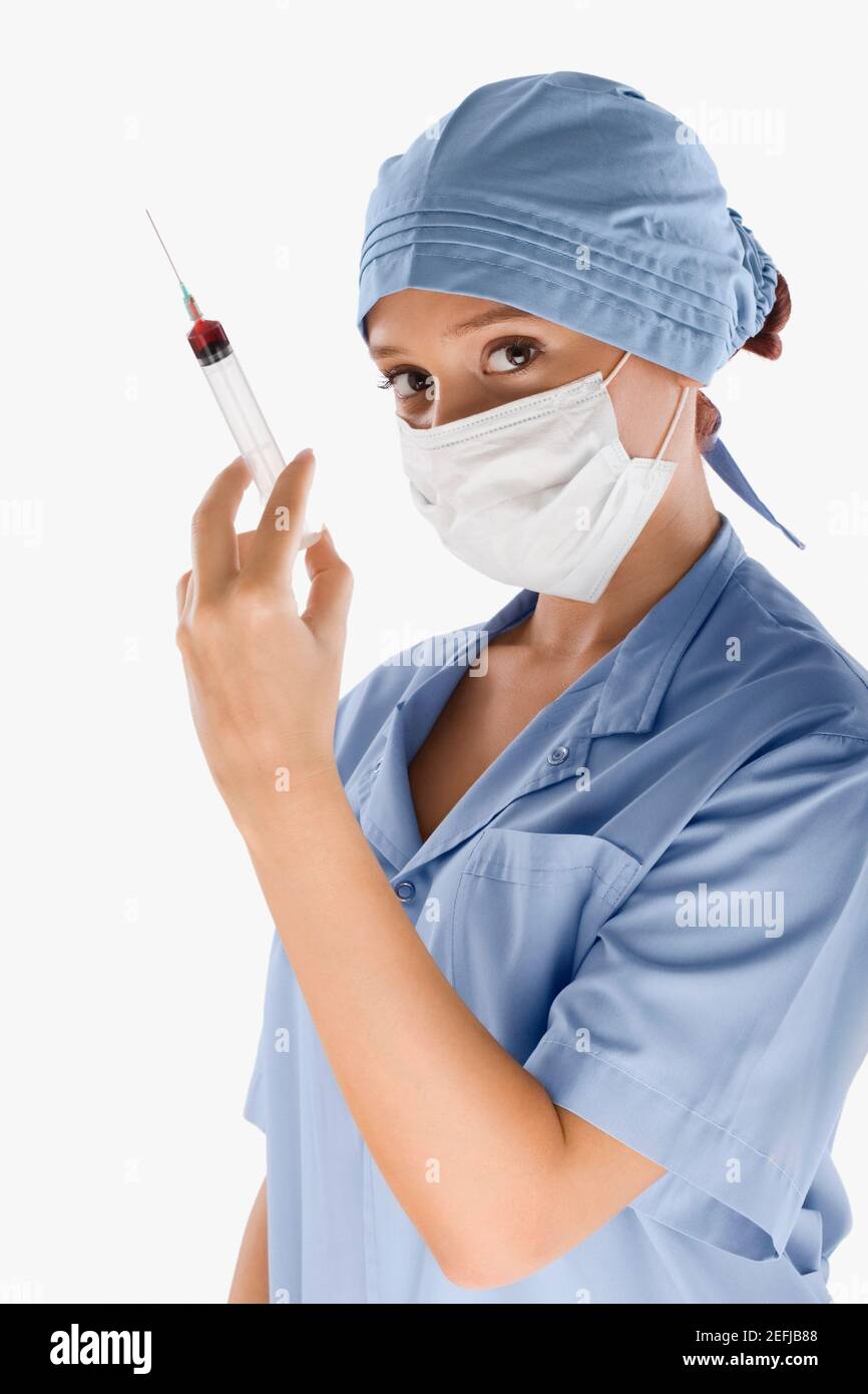 Portrait of a female surgeon holding a syringe Stock Photo - Alamy