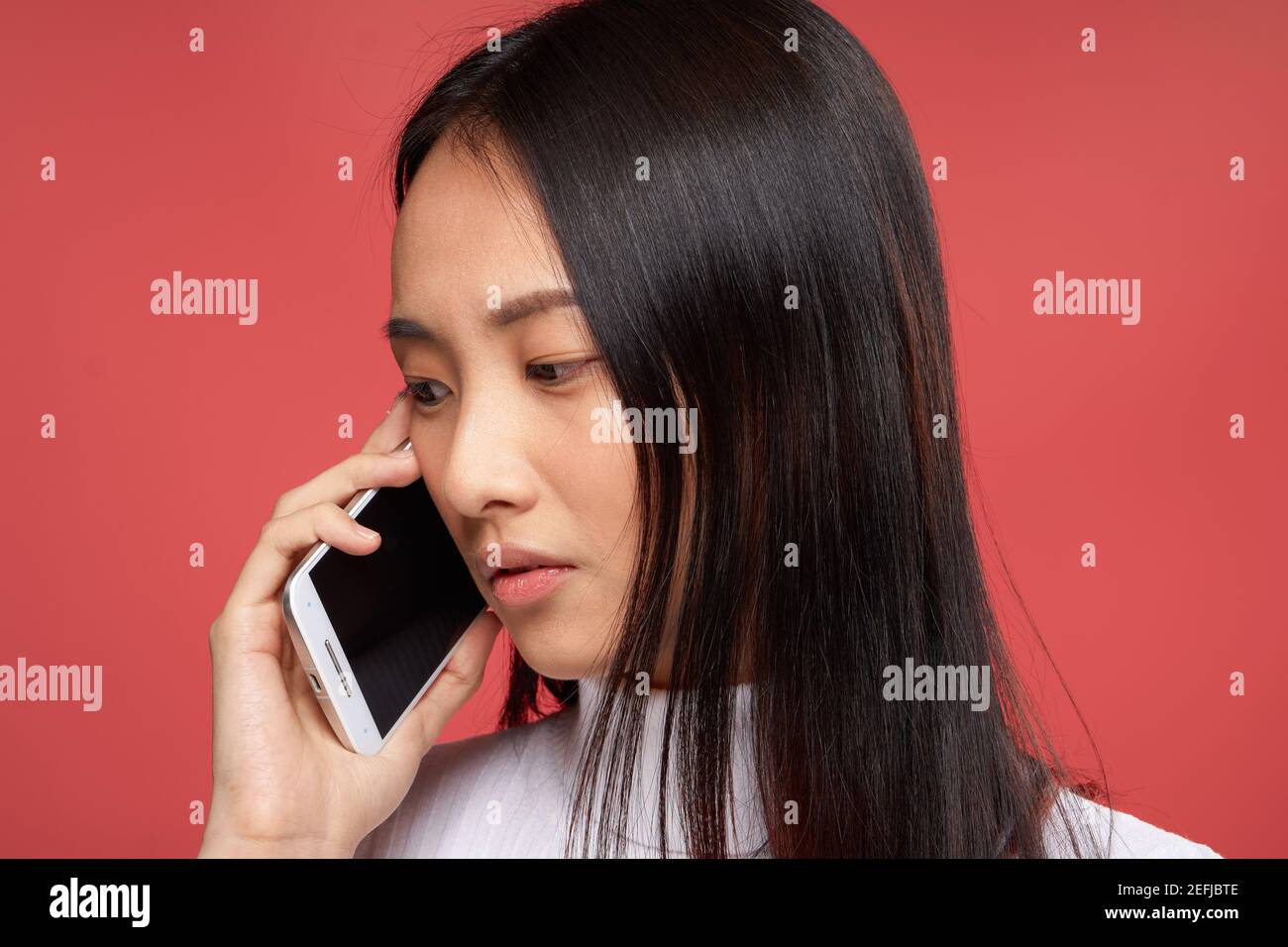 woman asian appearance studio cropped view talking on the phone Stock ...