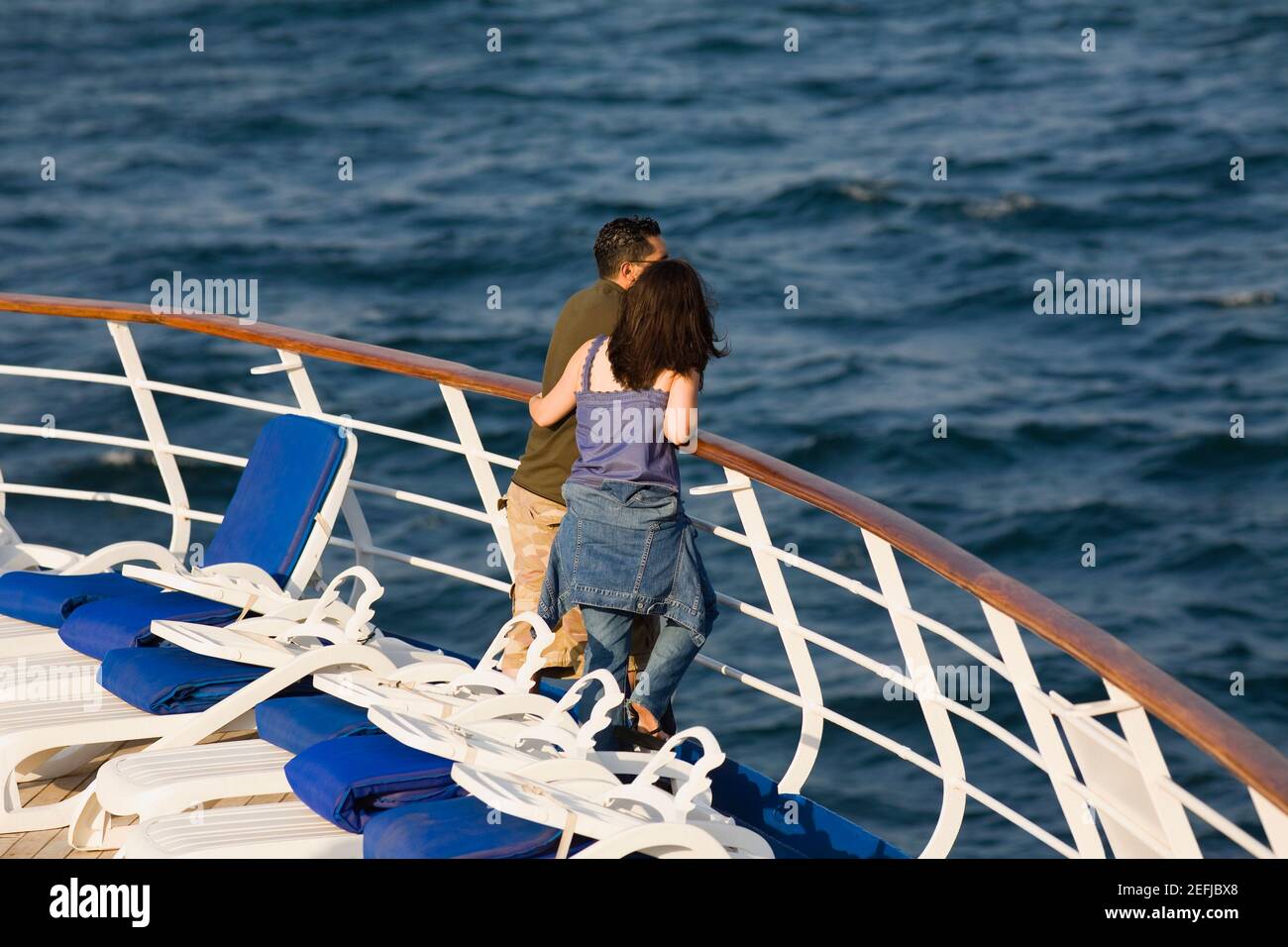 Couple leaning against railing hi-res stock photography and images - Alamy