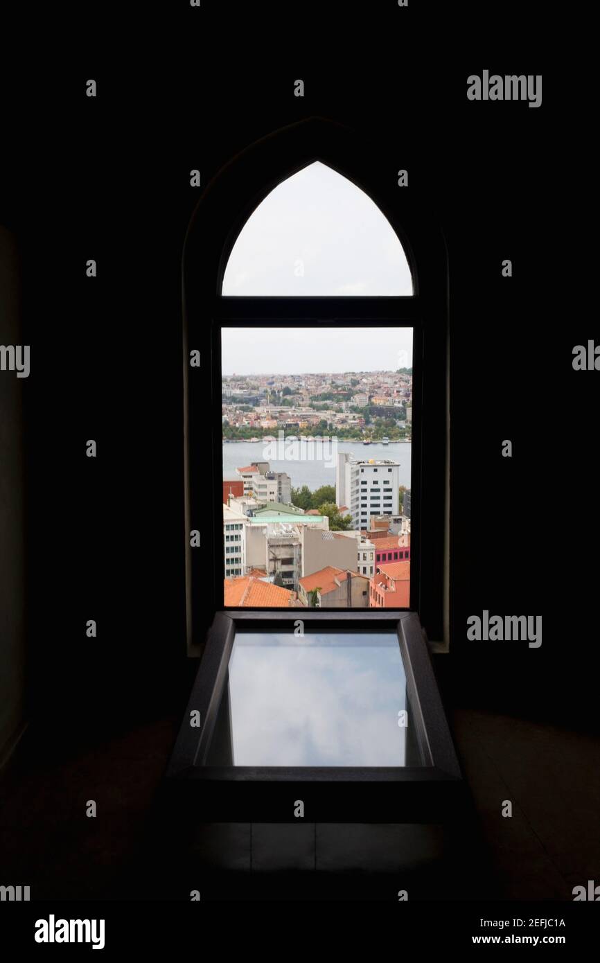 City viewed through an arched window of a building, Istanbul, Turkey ...