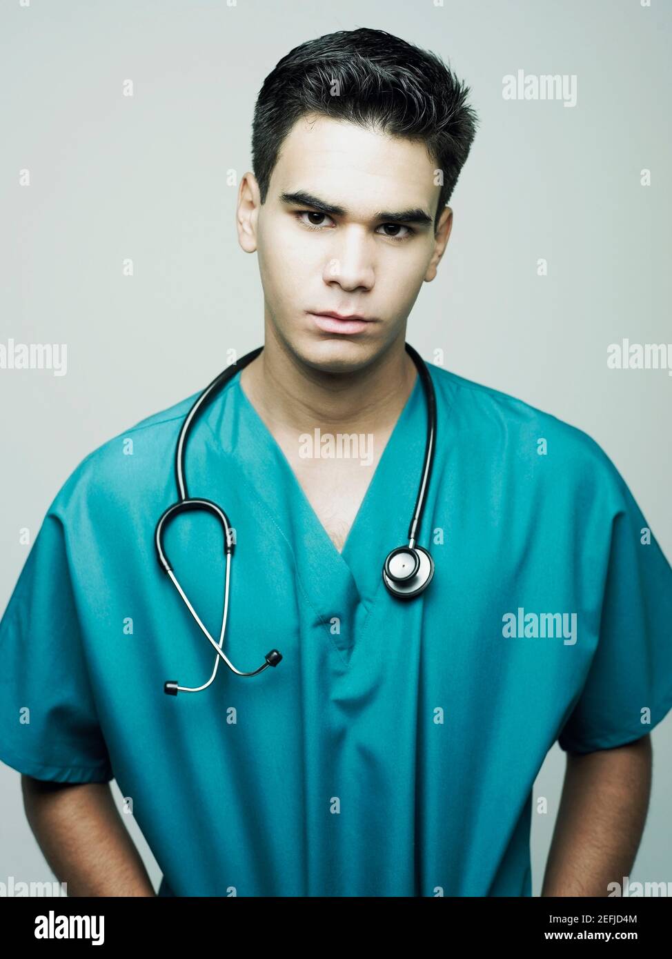 Portrait of a male surgeon wearing an operating gown Stock Photo - Alamy