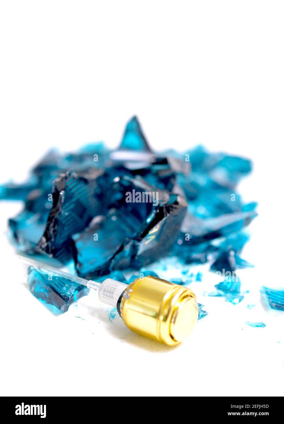 Broken perfume bottle on white background Stock Photo - Alamy