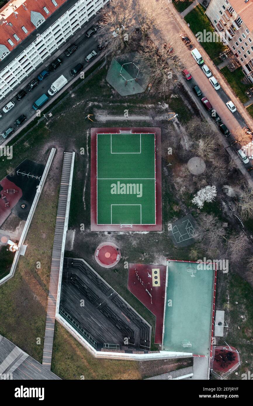 A sports complex including a football pitch, a basketball court and ...