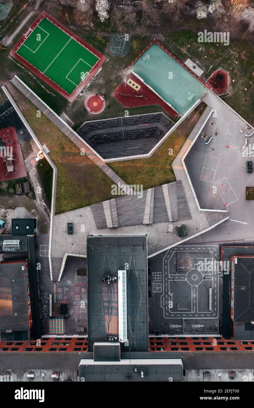 A sports complex including a football pitch, a basketball court and ...