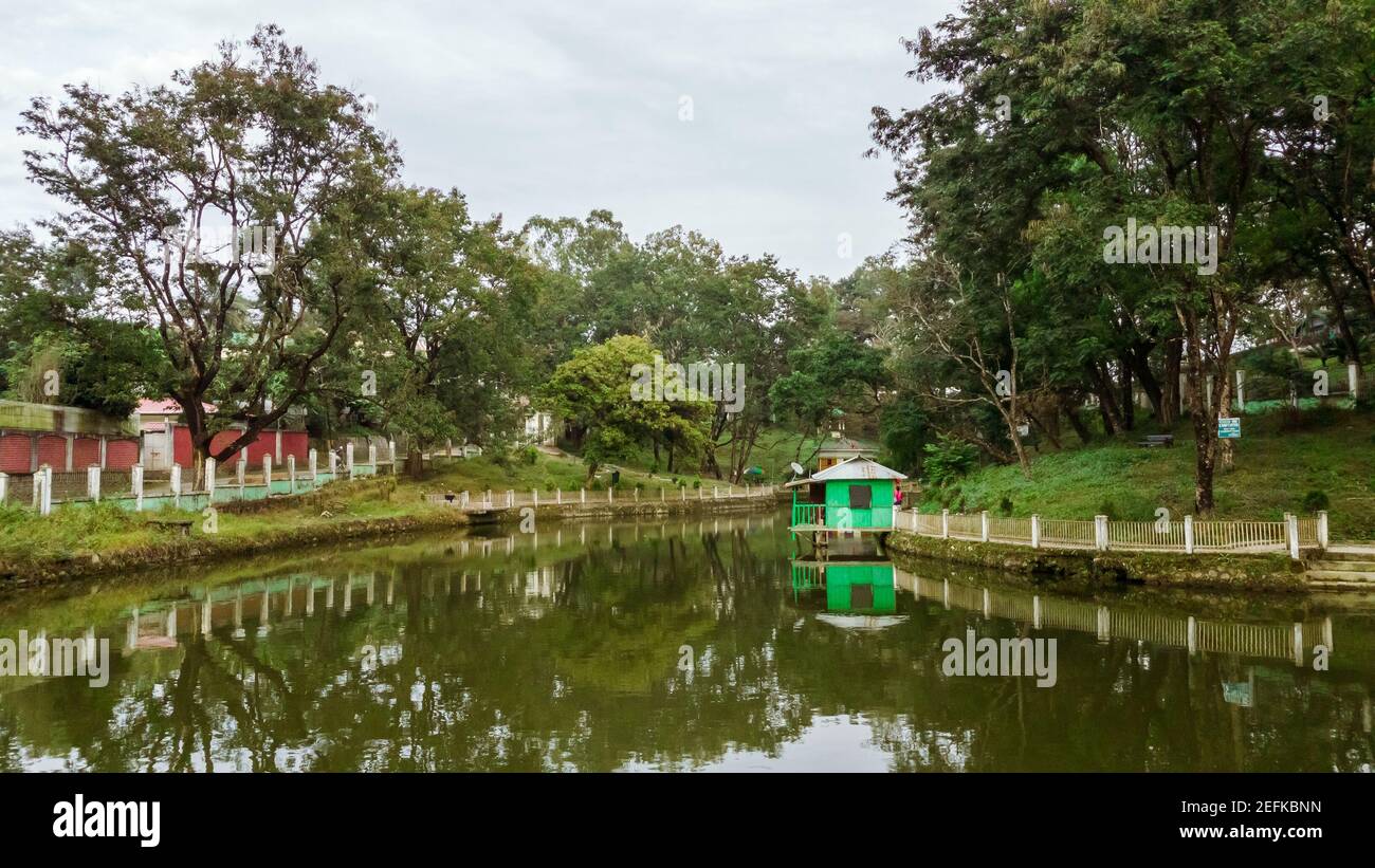 Haflong, Assam, India - January 2018: Reflections of trees in the ...