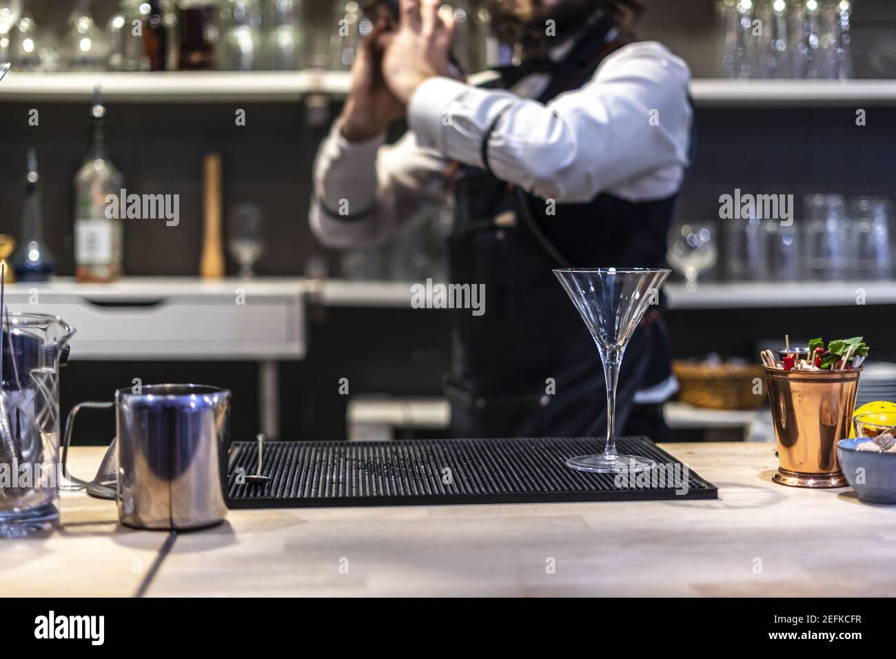 Bartender making an alcoholic drink at the night club Stock Photo - Alamy